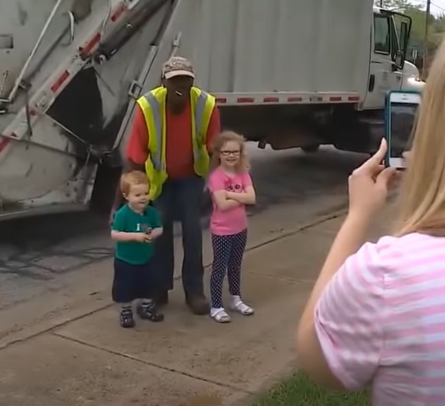 Toddler waits outside for garbage man bestie to give him a sweet ...