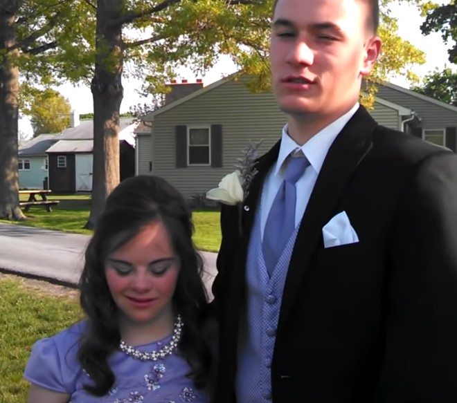 HS quarterback keeps childhood promise and takes teen with Down ...