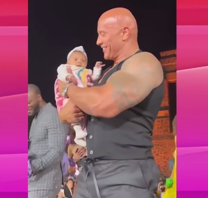 Dad crowd surfs his baby to The Rock at movie premiere and it’s all ...