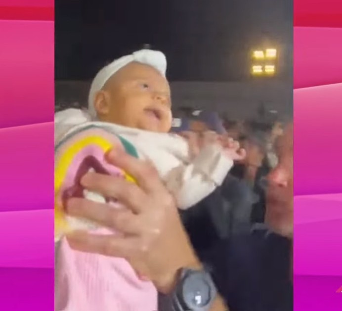 Dad crowd surfs his baby to The Rock at movie premiere and it’s all captured on camera