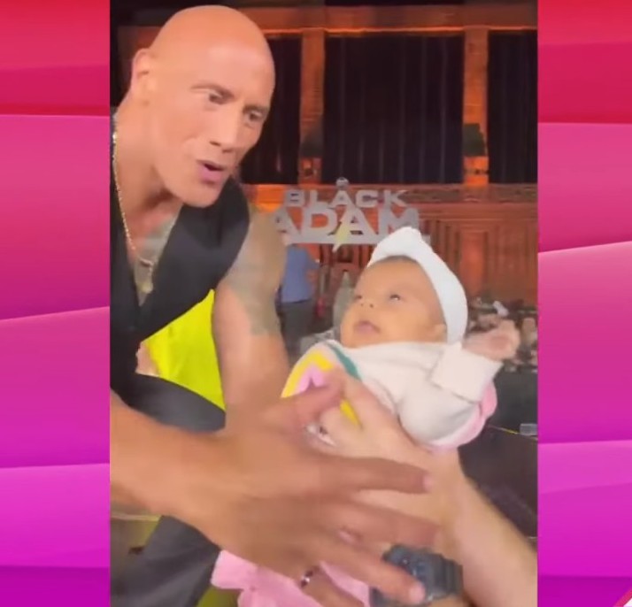 Dad crowd surfs his baby to The Rock at movie premiere and it’s all ...