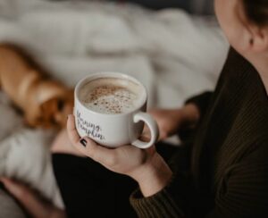 Guy demonstrates how to create a mini heater out of a clay pot to keep ...