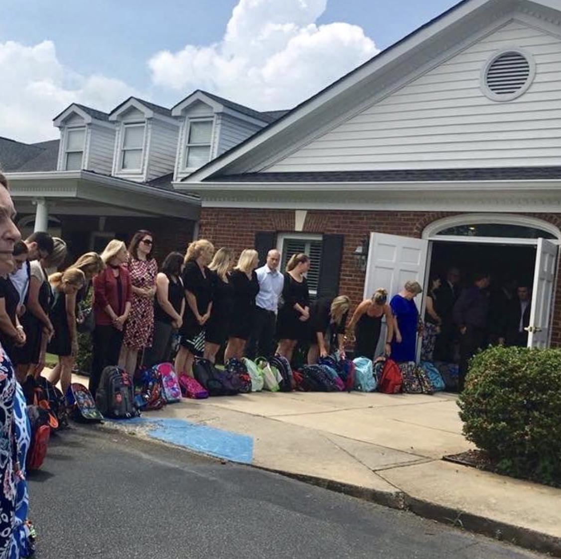People arrive at funeral with backpacks to fulfill beloved woman’s last request