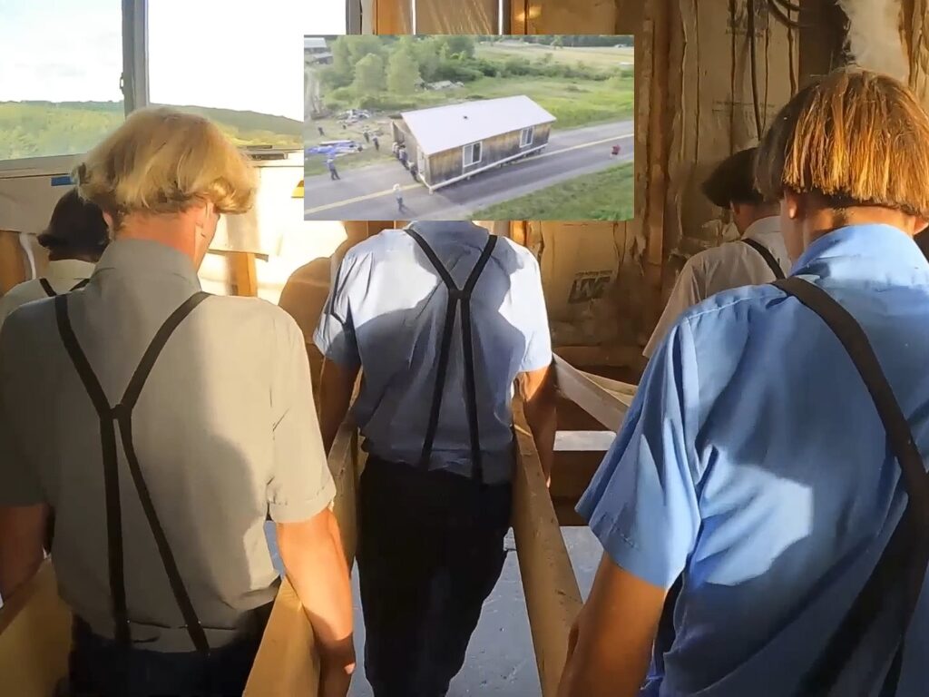 Group of Amish men move entire building using only their brute strength