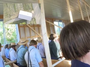 Group of Amish men move entire building using only their brute strength